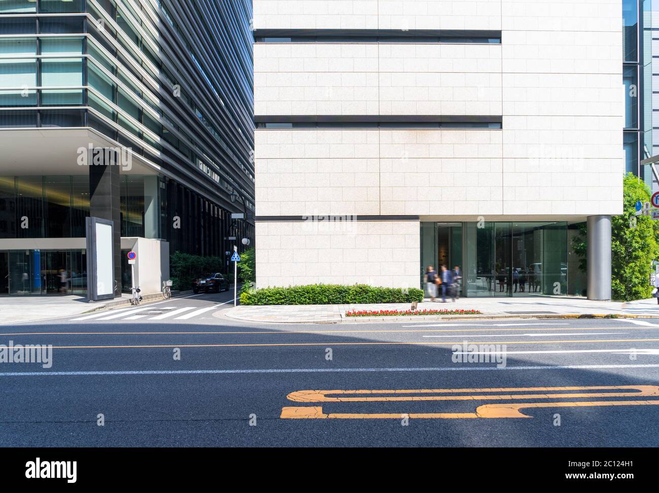 modern office buildings in tokyo from urban road with sunbeam Stock ...