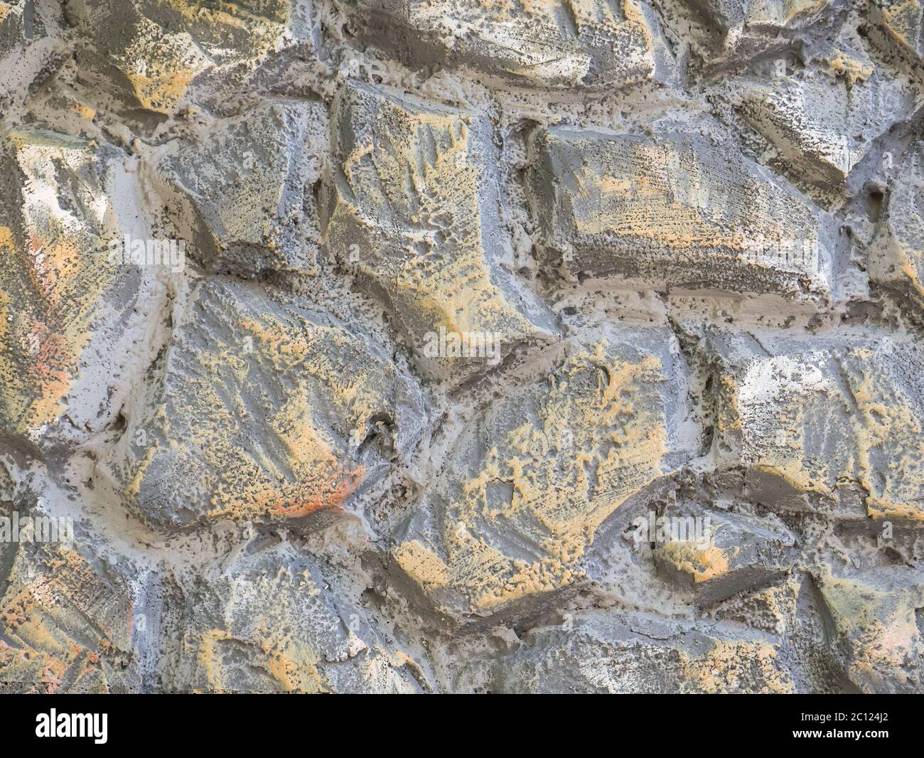 Yellow and orange colored bricks or stone blocks pattern texture ...