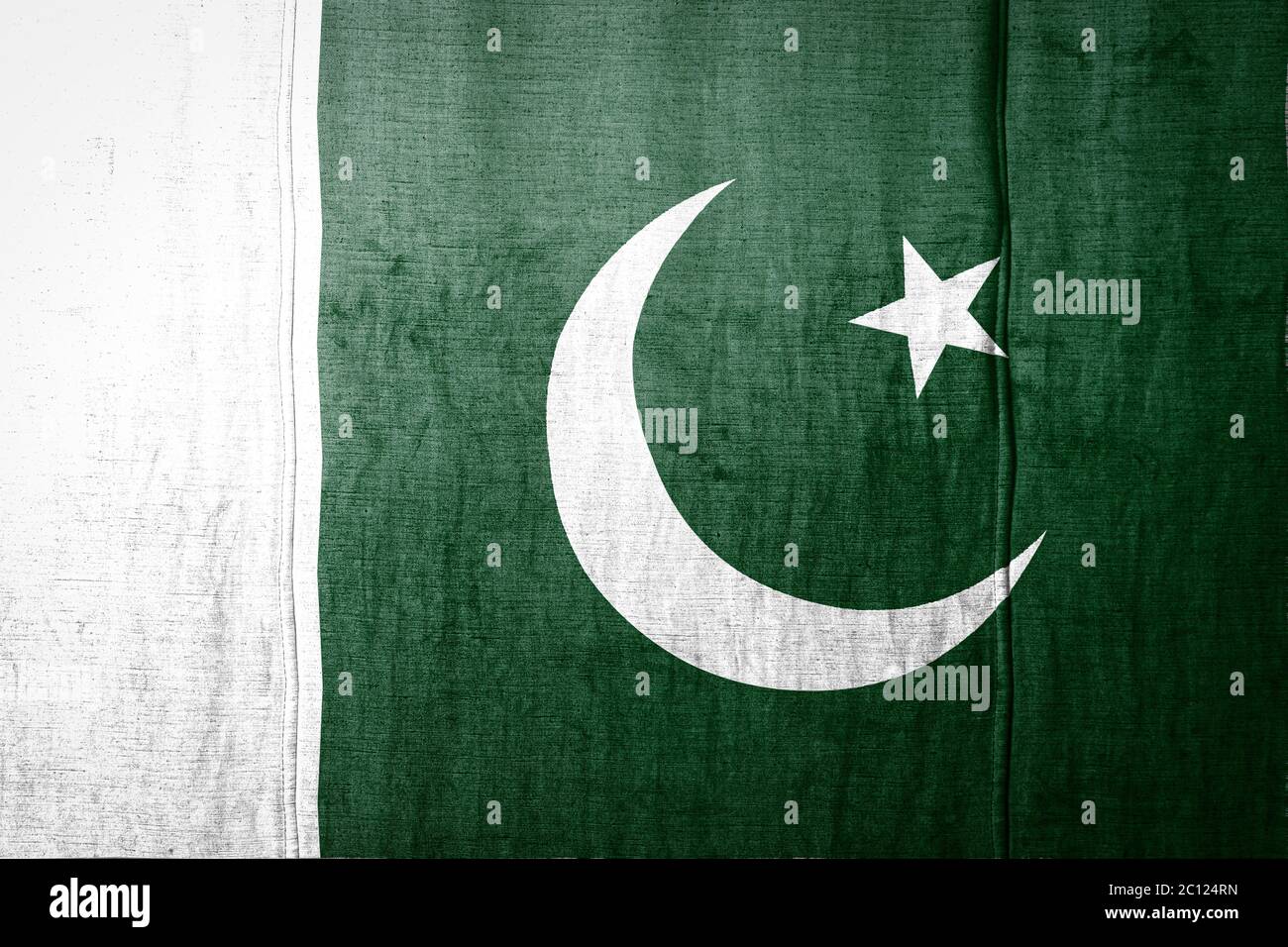 National flag of Pakistan depicting in paint colors on old textile ...