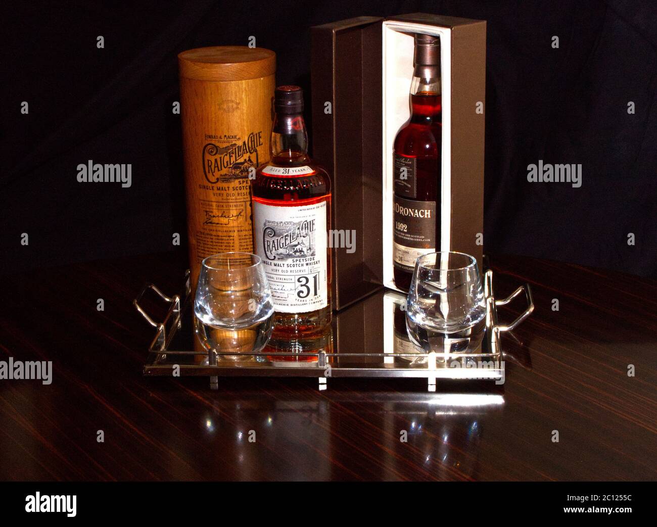 A small part of a fine Malt Whiskey collection, glasses and mirror tray ...