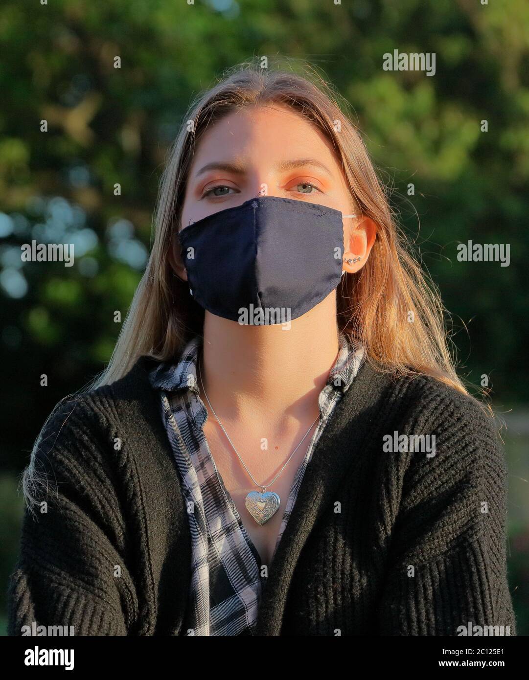 Girl wearing PPE outdoors during Covid-19 pandemic Stock Photo - Alamy