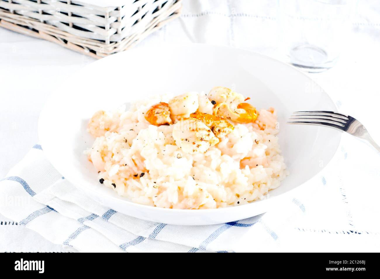 Delicious risotto with shrimp and scallops Stock Photo - Alamy