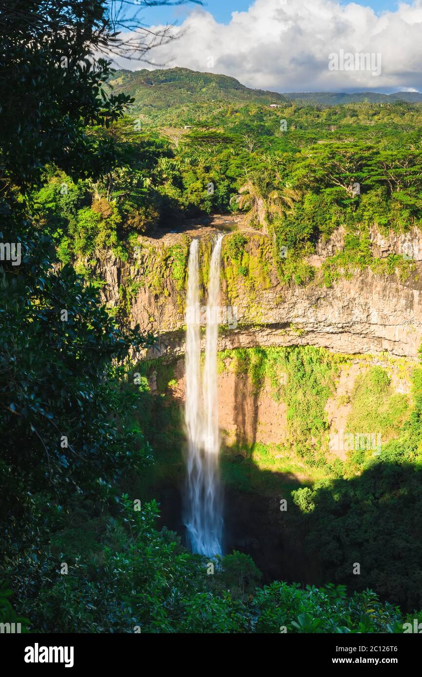 Chamarel waterfall with rock in tropical jungle of Mauritius Stock ...