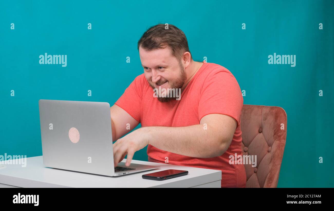 Funny frames of male using laptop. man working on a computer pretending ...