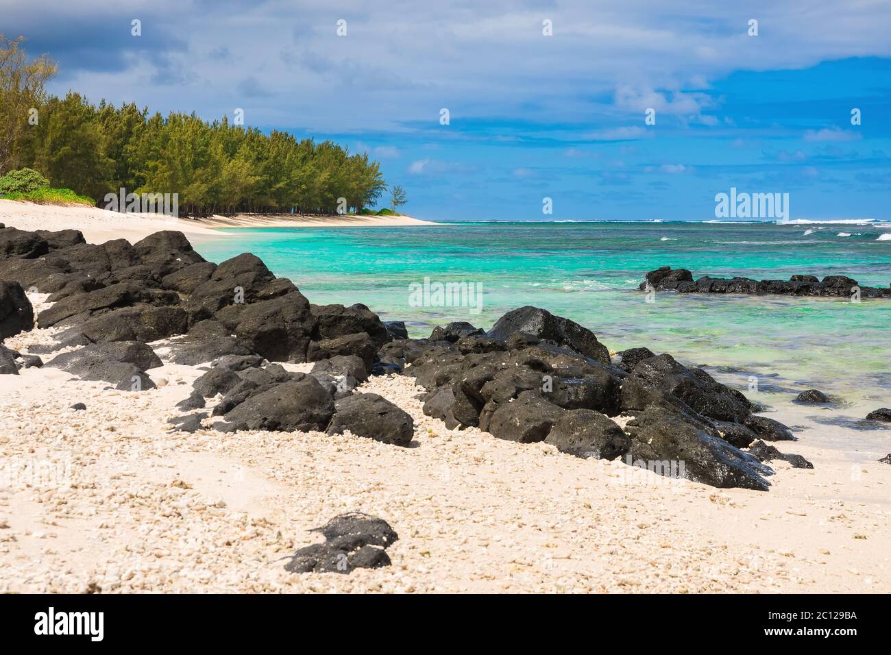 Beautiful tropical beach with sand, rocks, transparent ocean and blue ...