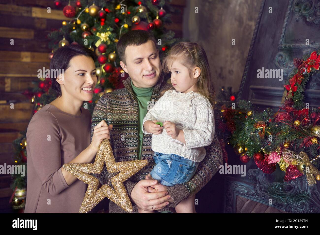 Christmas family portrait In home holiday living room Stock Photo - Alamy