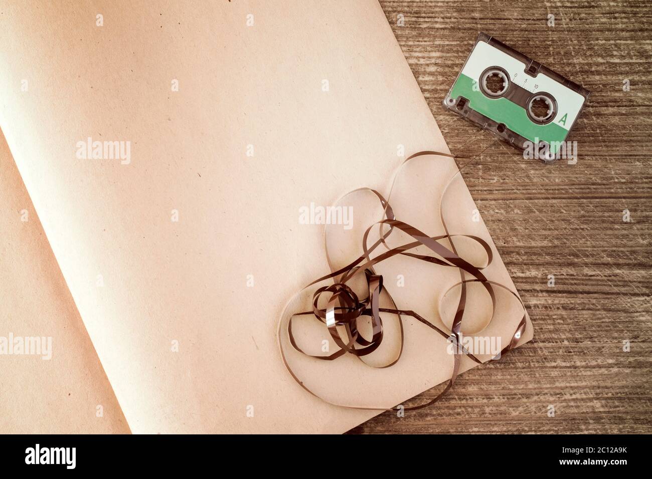 Audio cassette and open book Stock Photo - Alamy