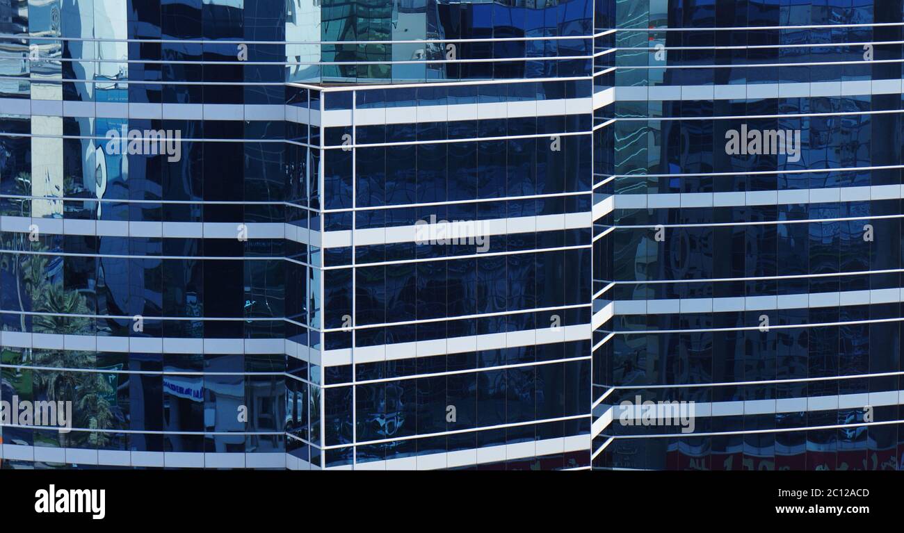 glass wall of a building with a ledge Stock Photo - Alamy