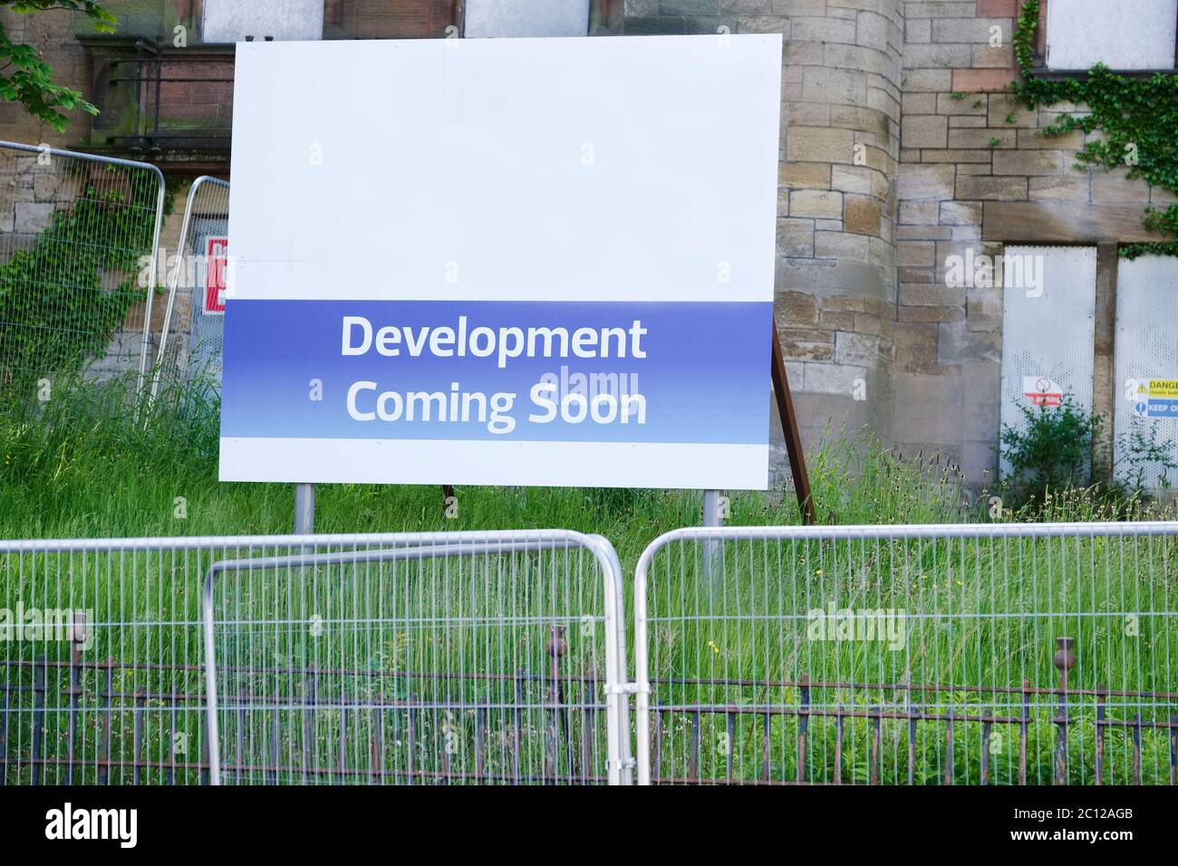 Development for housing and flats coming soon sign Stock Photo - Alamy