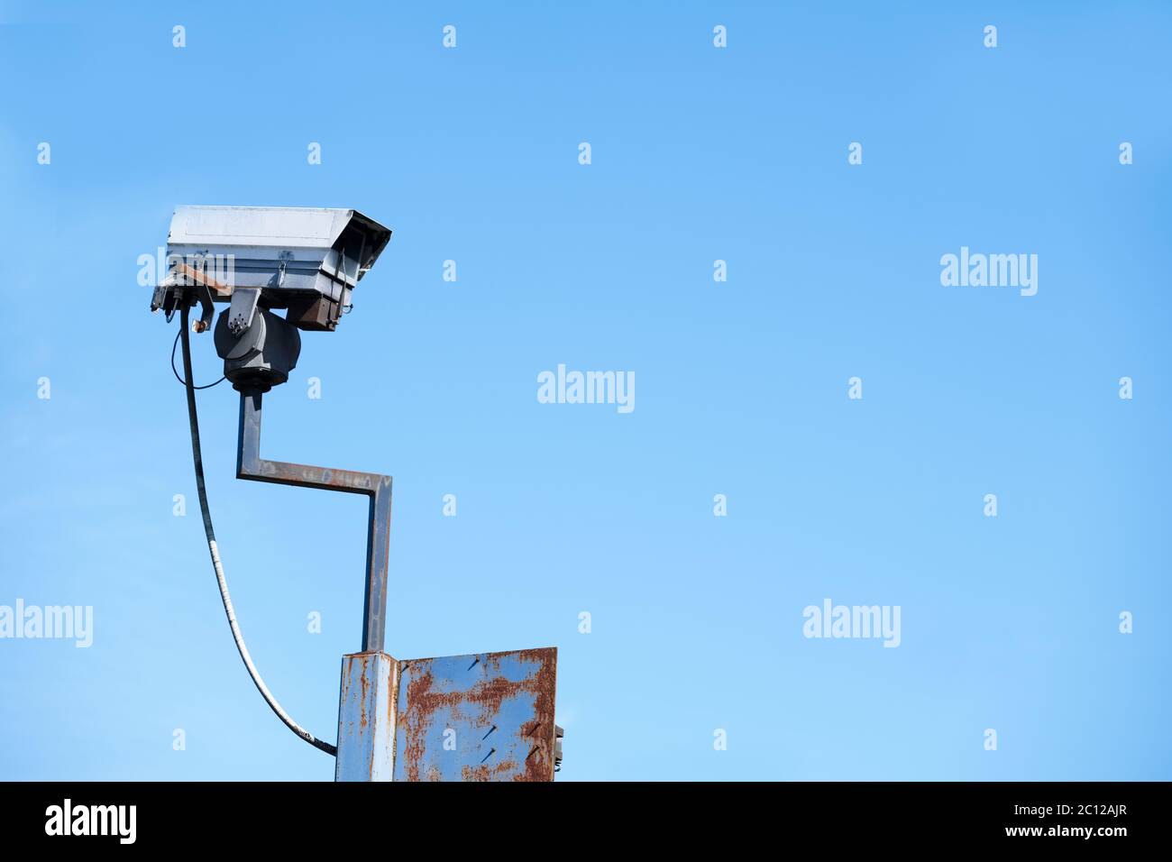 CCTV camera in sky watching people on street Stock Photo - Alamy