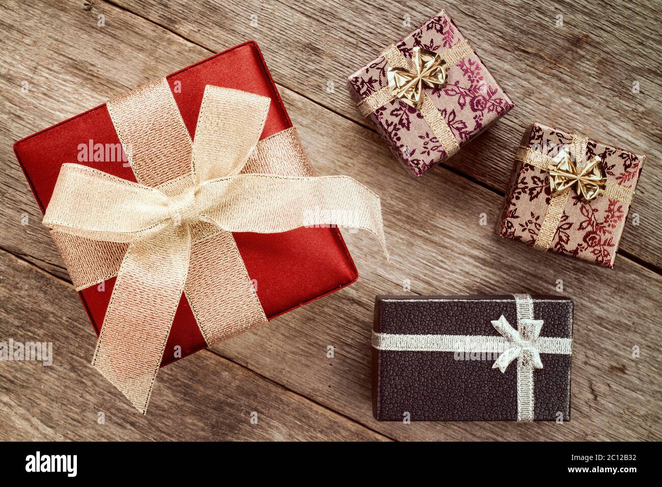 Four festive gift boxes Stock Photo - Alamy