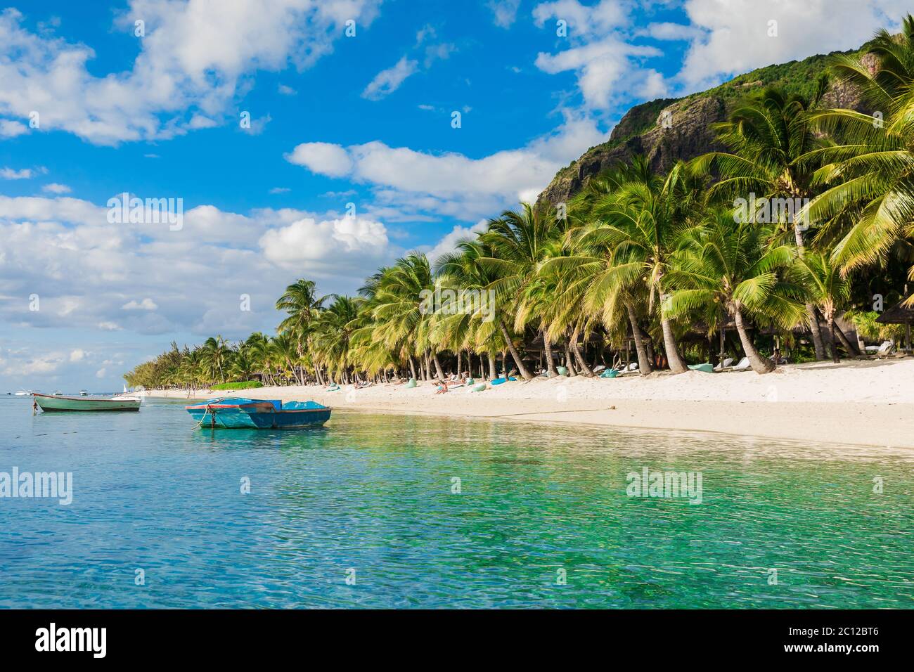 Tropical view of the resort on Mauritius. Ocean with boat, sandy beach ...