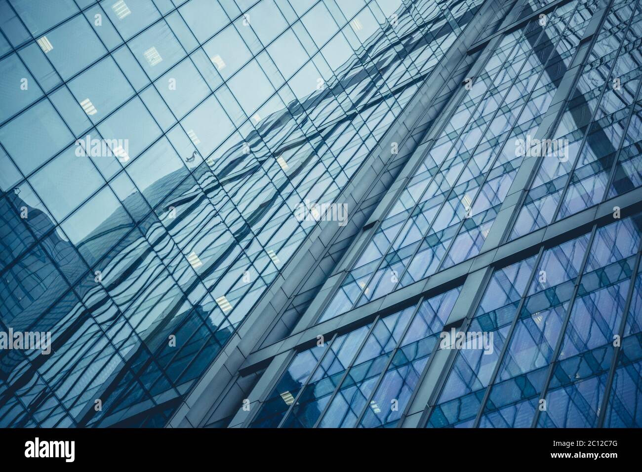 Perspective and underside of contemporary glass building skyscrapers at ...