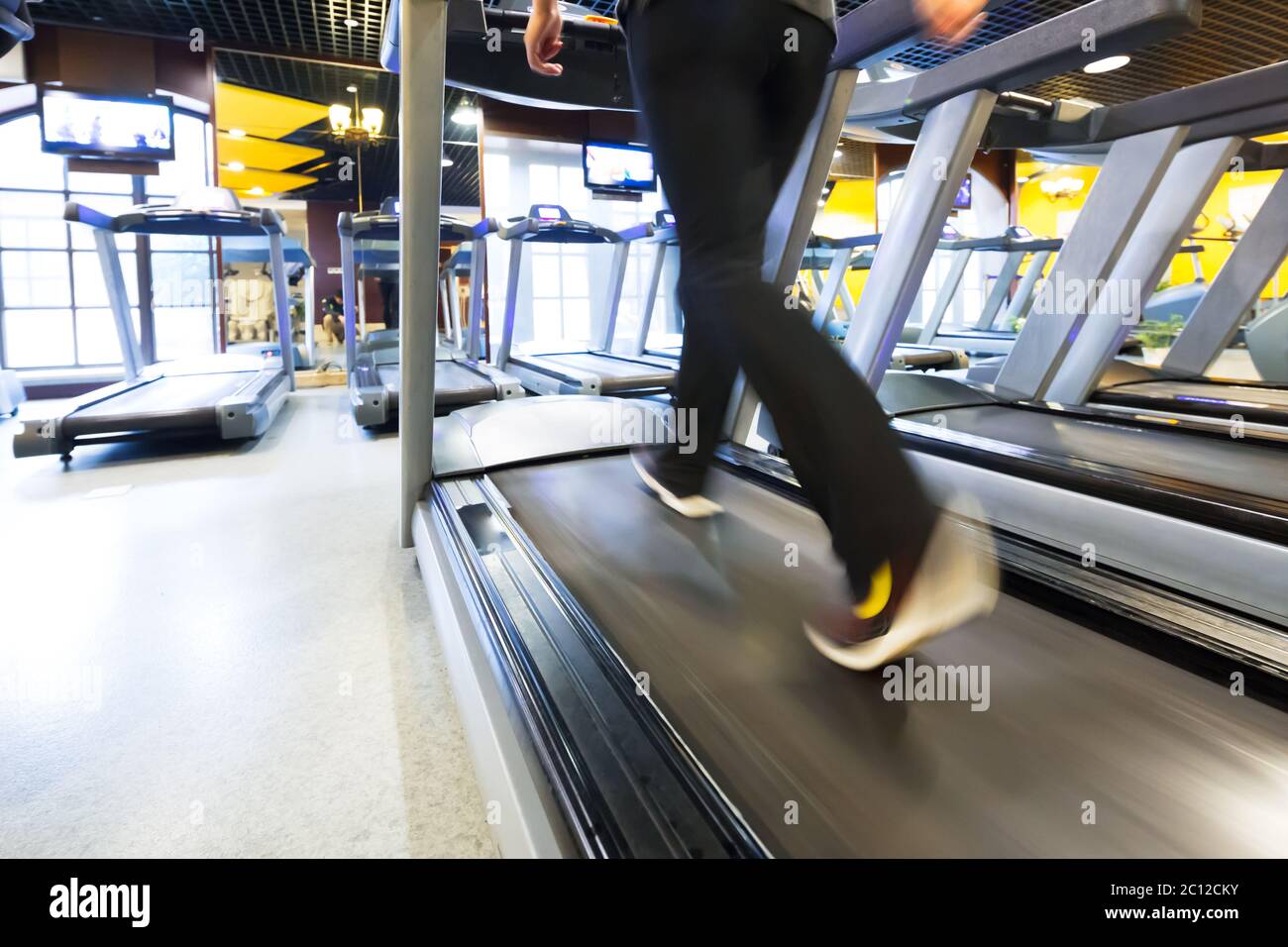 interior of modern gym with people working out Stock Photo - Alamy