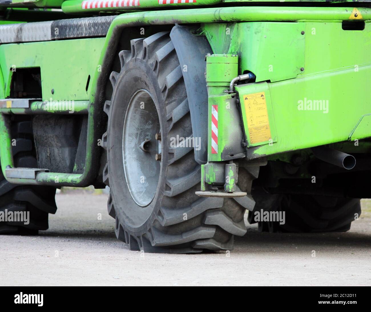 Truck strong outrigger stabilizing legs extended. Boom lifts building ...