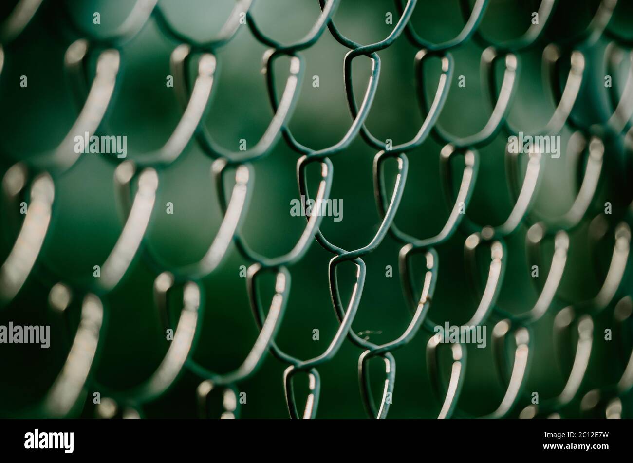 Close up artistic moody green metal wire fence pattern Stock Photo - Alamy