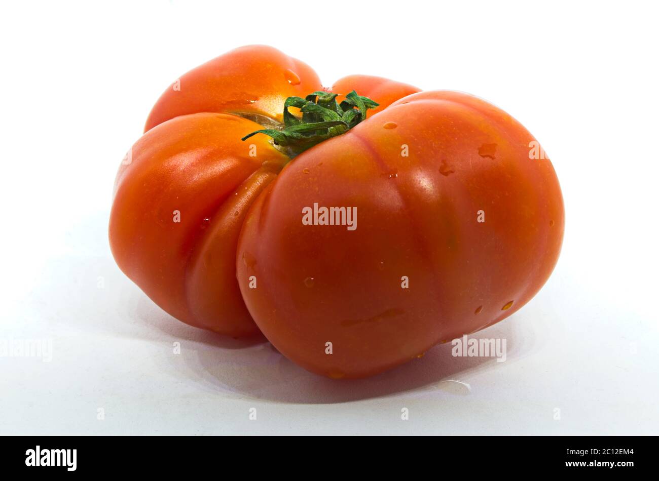 Red raf tomato on white background Fresh vegetable. Healthy eating ...