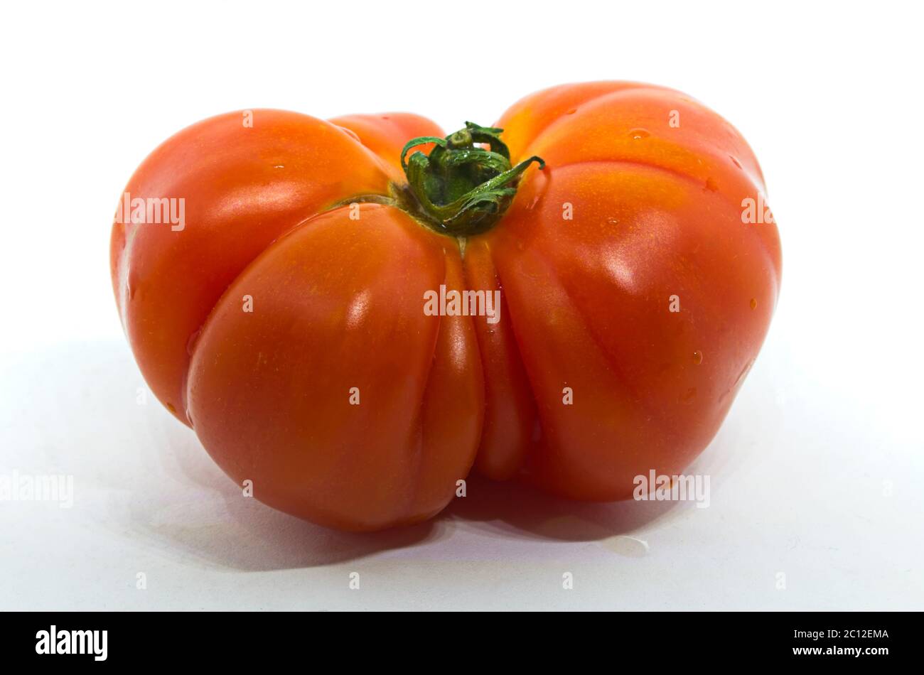 Red raf tomato on white background Fresh vegetable. Healthy eating ...