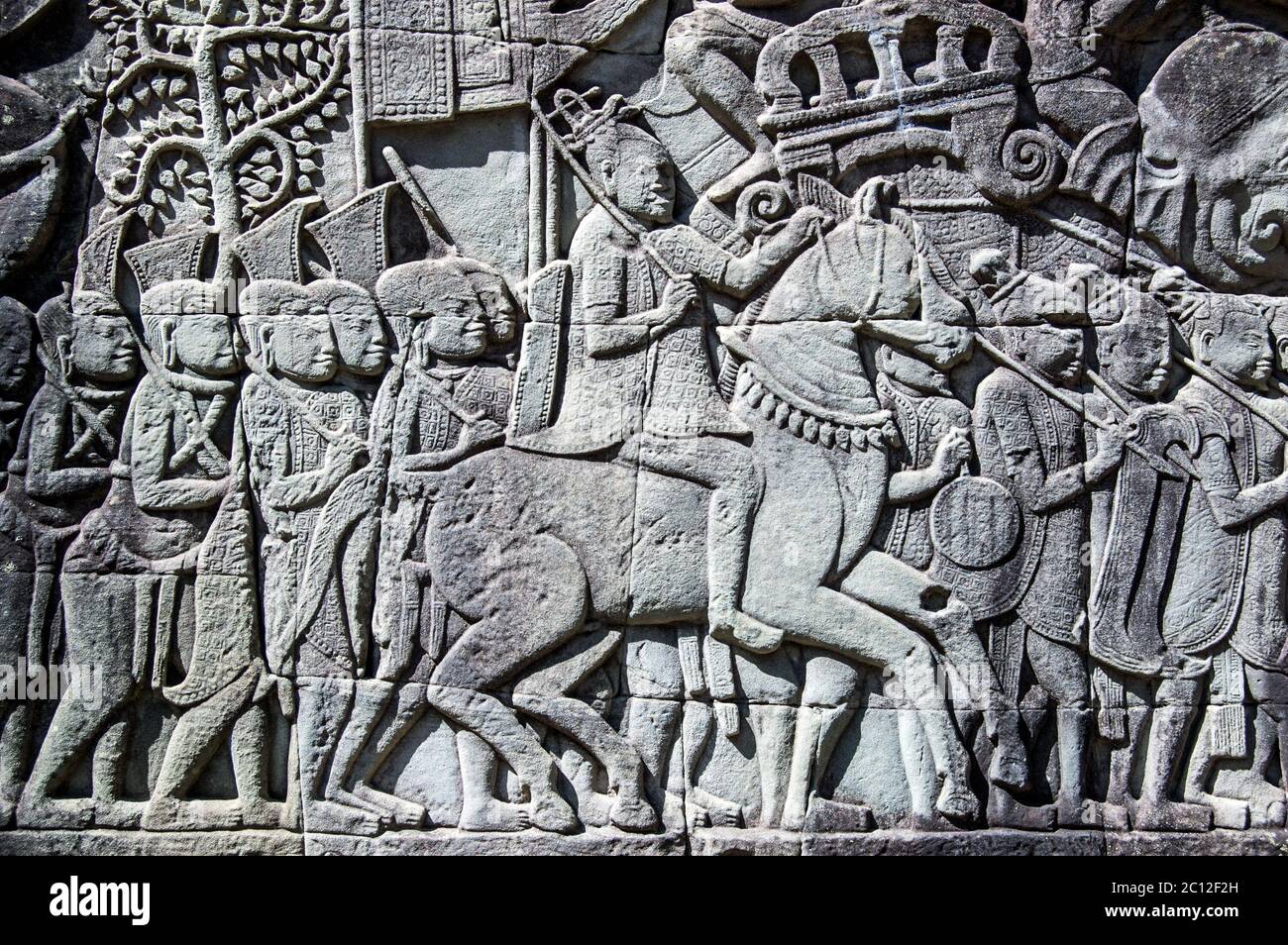 A Khmer army military commander riding his horse as as his army marches ...