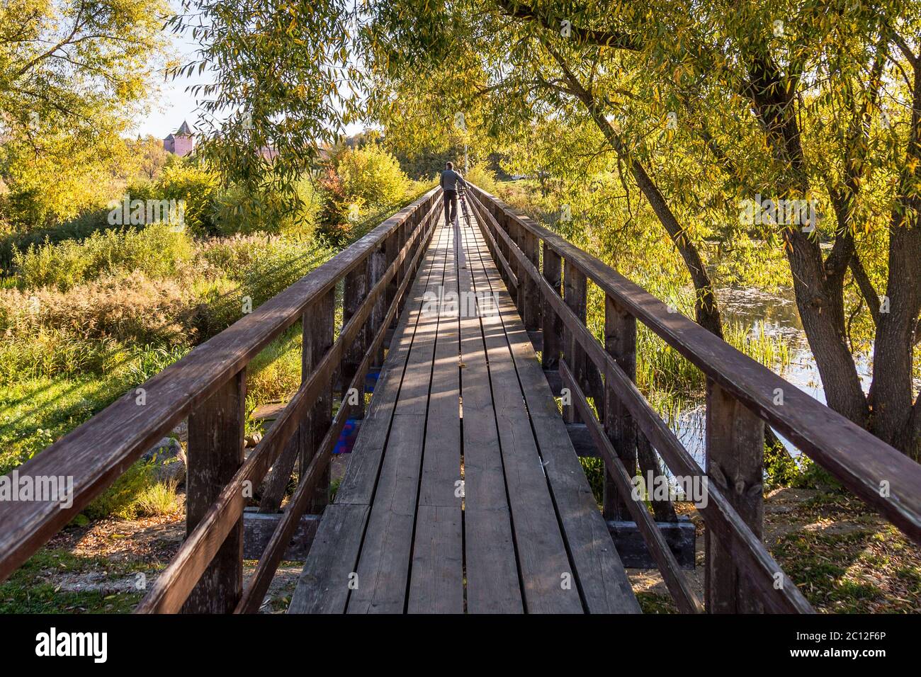 wide angle wooden bridge over river Stock Photo - Alamy