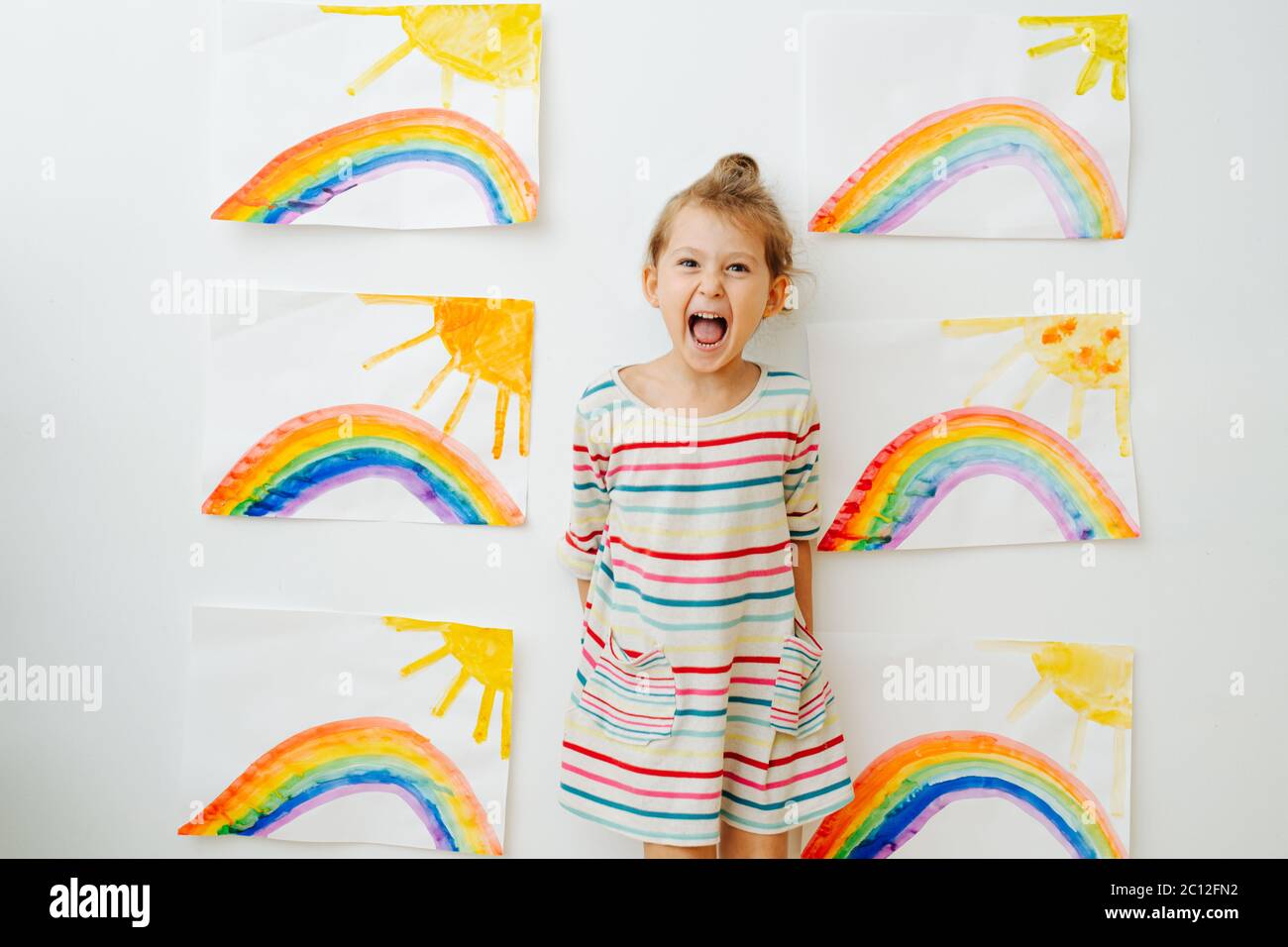 Hyperemotional child cheering to the amount of rainbow paintings on the ...