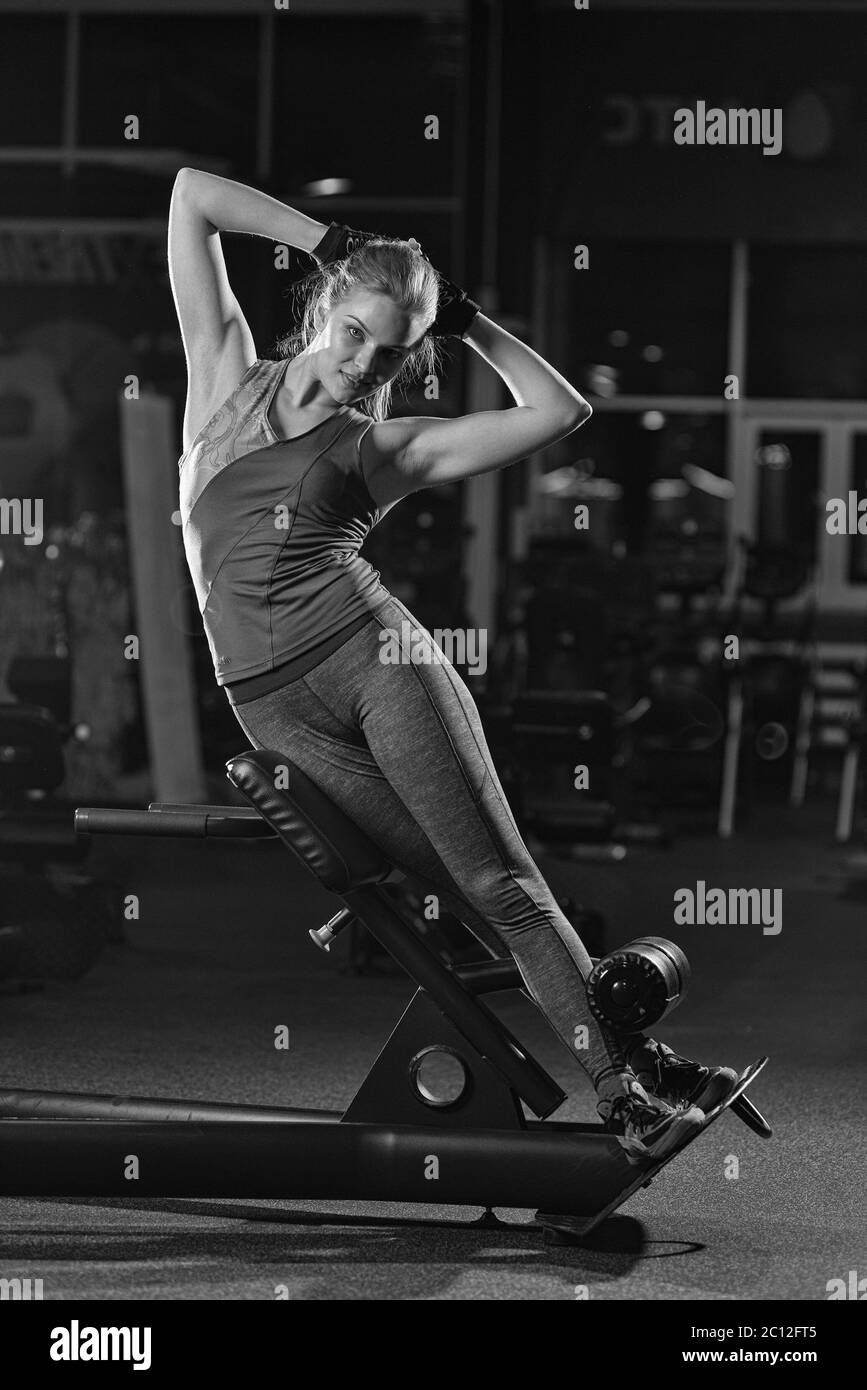 Woman doing strength exercises for abs muscles Stock Photo - Alamy