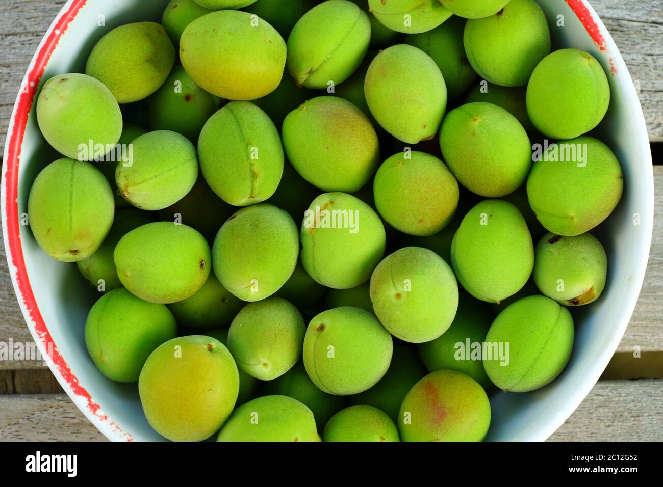 Bowl of green ume Japanese apricot plum fruit Stock Photo - Alamy