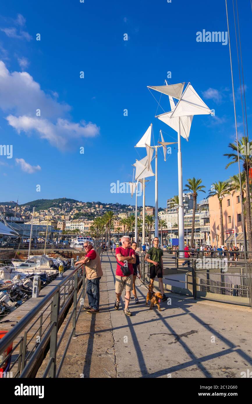 Genoa, Italy - August 18, 2019: tourists and locals walk along the ...