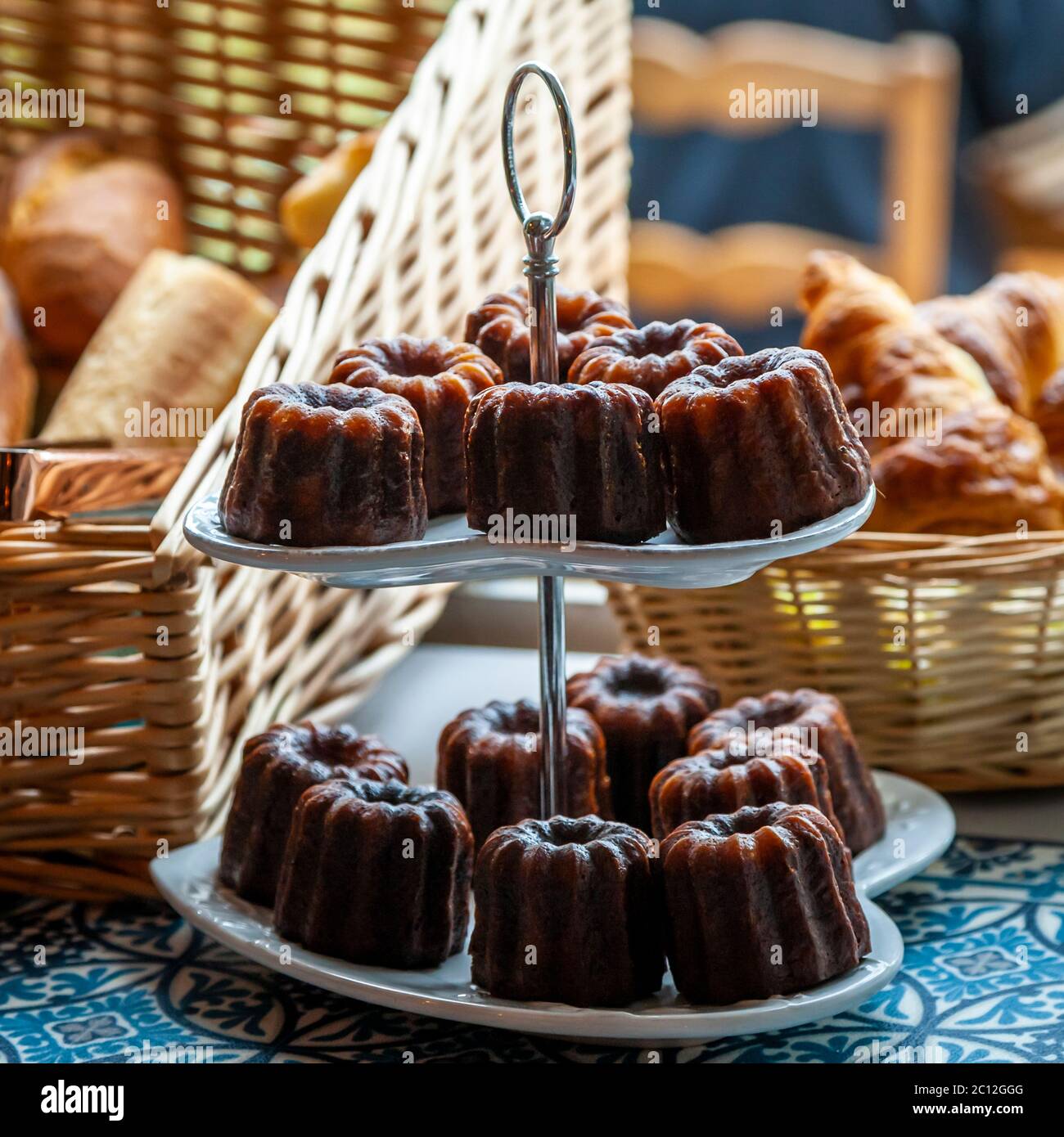 Canelé is a French pastry flavored with rum and vanilla Stock Photo - Alamy