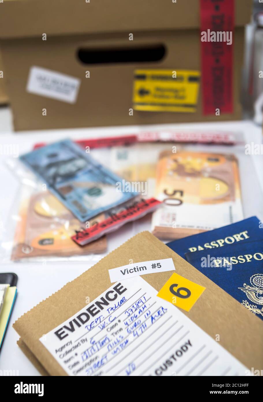 Evidence bag next to passports in criminal investigation unit ...