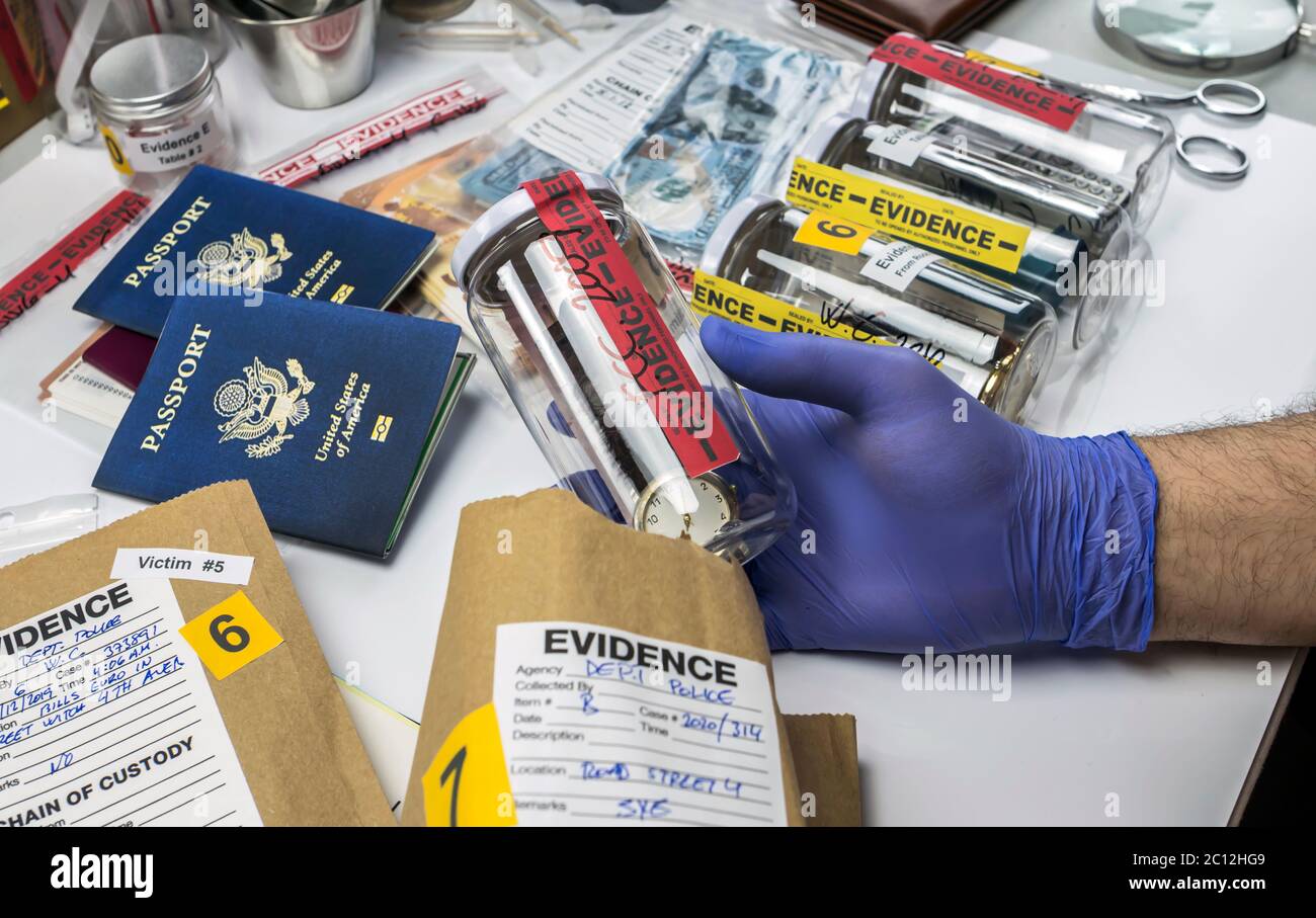 Police scientist working in Criminalistic Lab, victim clock analysis ...