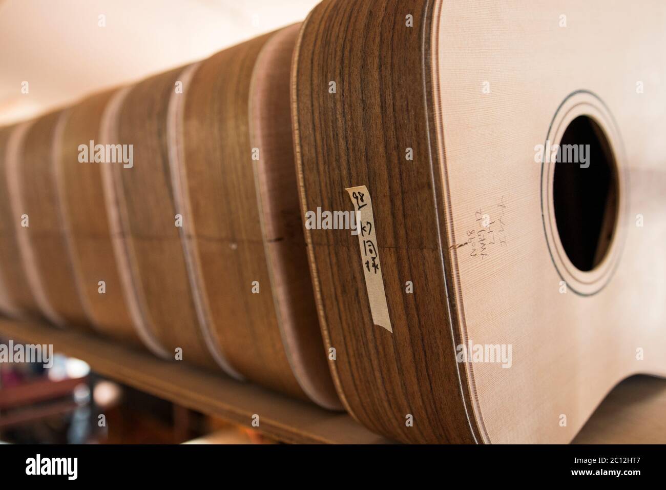Guitars and ukeleles in production at Yairi guitar factory in Kani City ...