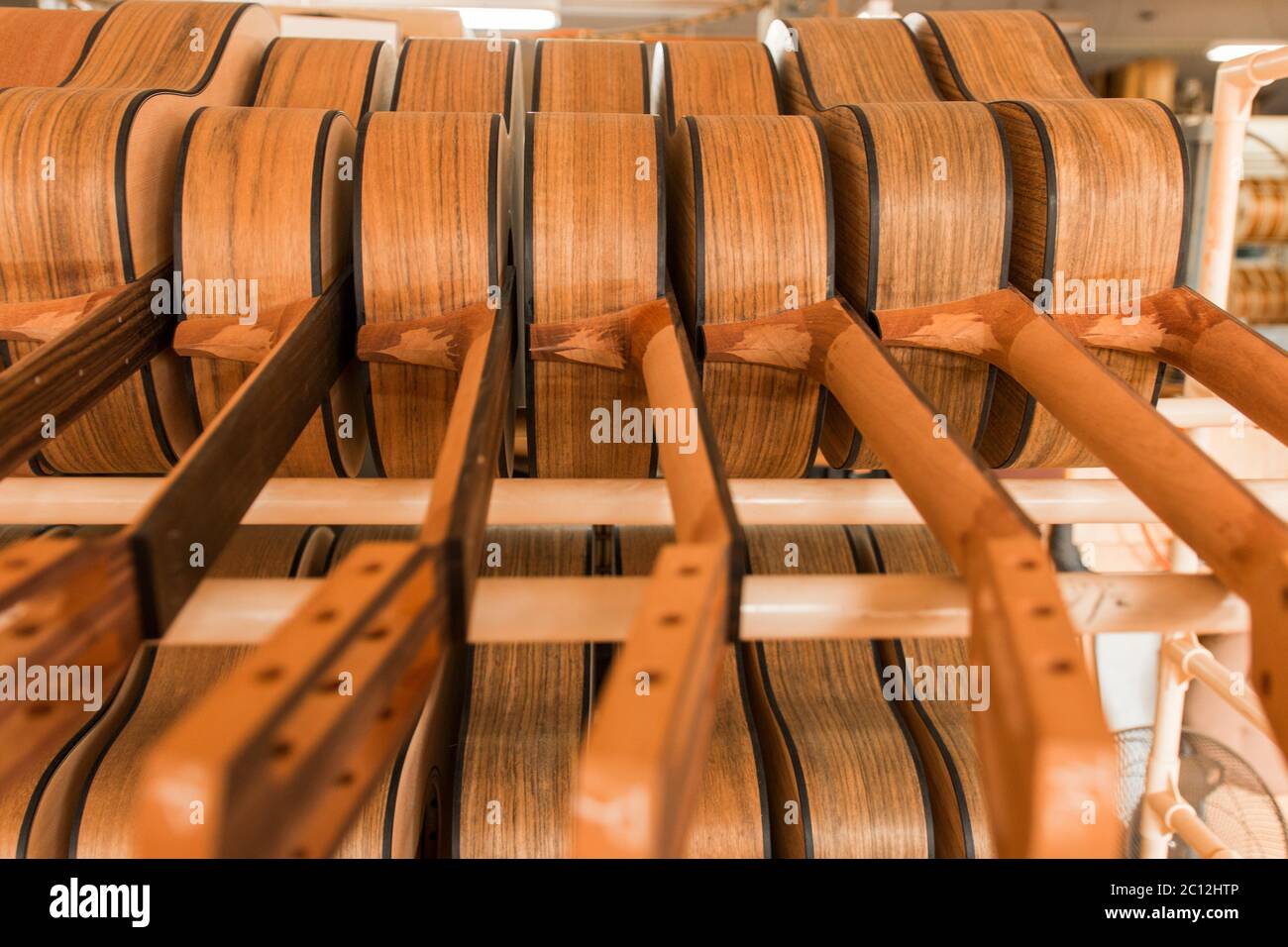 Guitars and ukeleles in production at Yairi guitar factory in Kani City ...