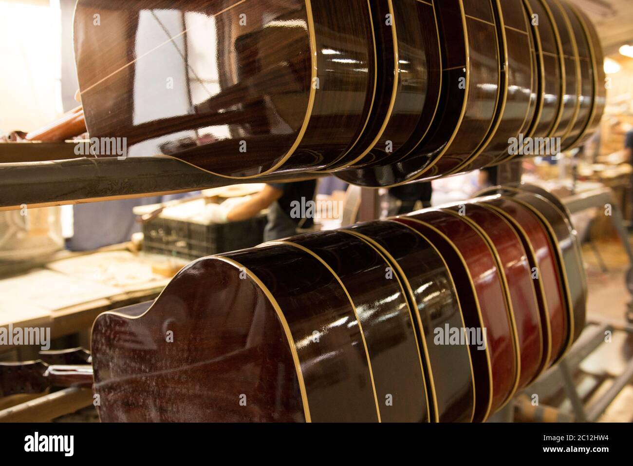 Guitars and ukeleles in production at Yairi guitar factory in Kani City ...
