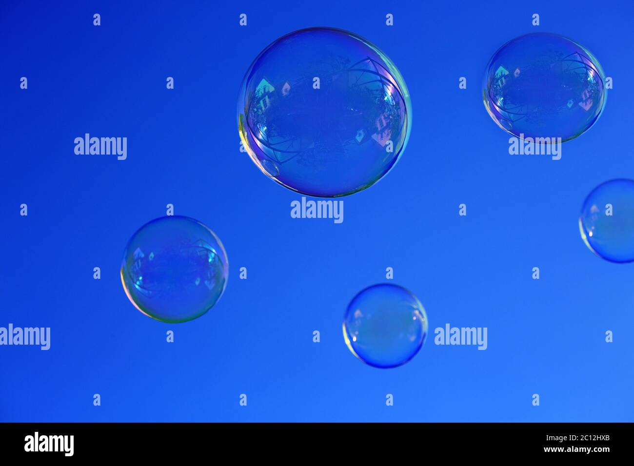 Soap bubbles against blue sky Stock Photo - Alamy