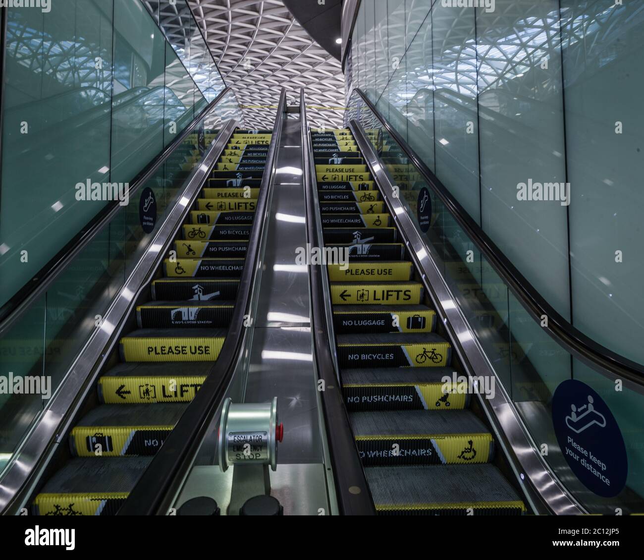 Escalators baring covid messages at Kings Cross train station in London ...