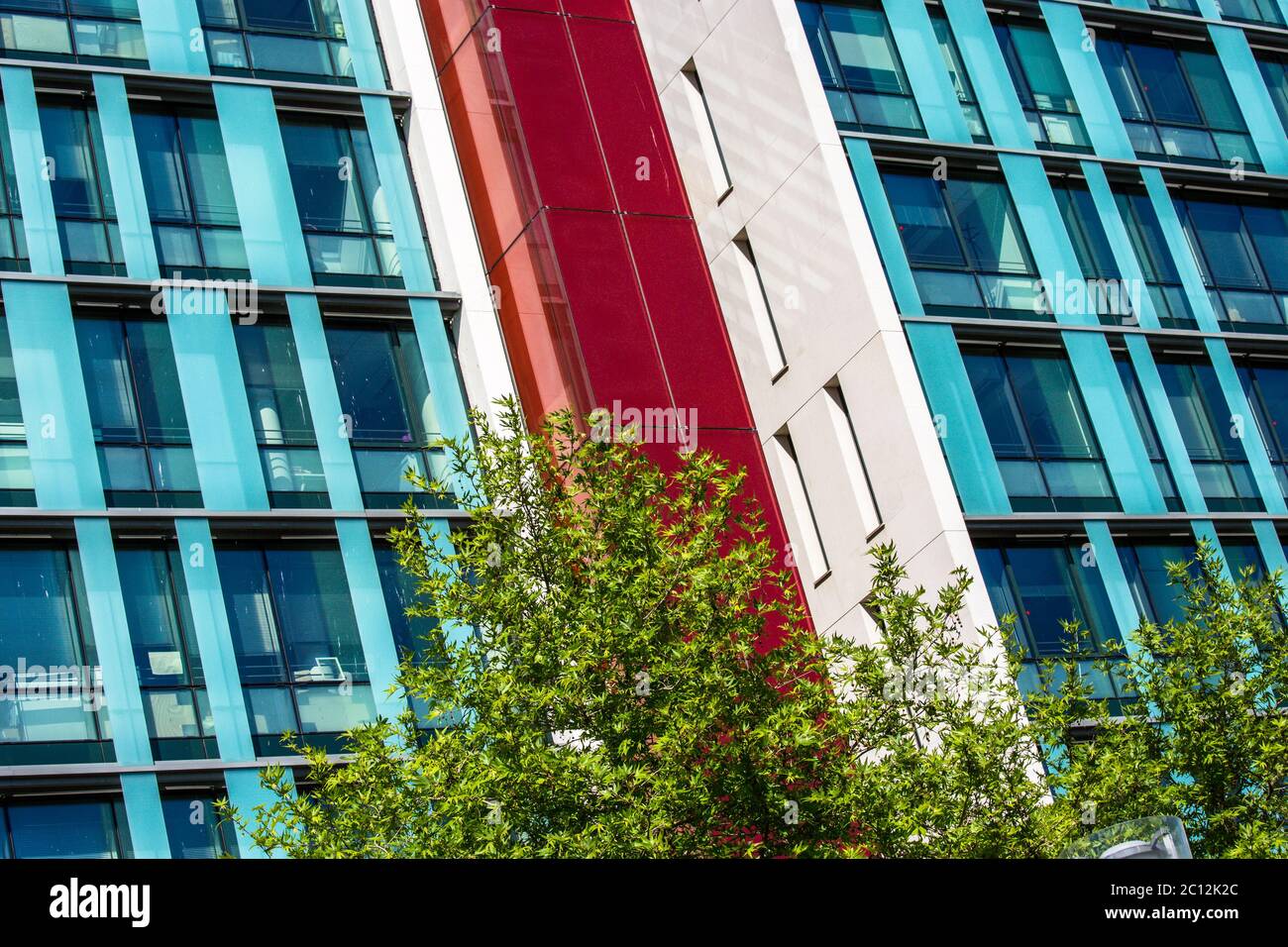 Two gigantic glass buildings adjoined together Stock Photo - Alamy