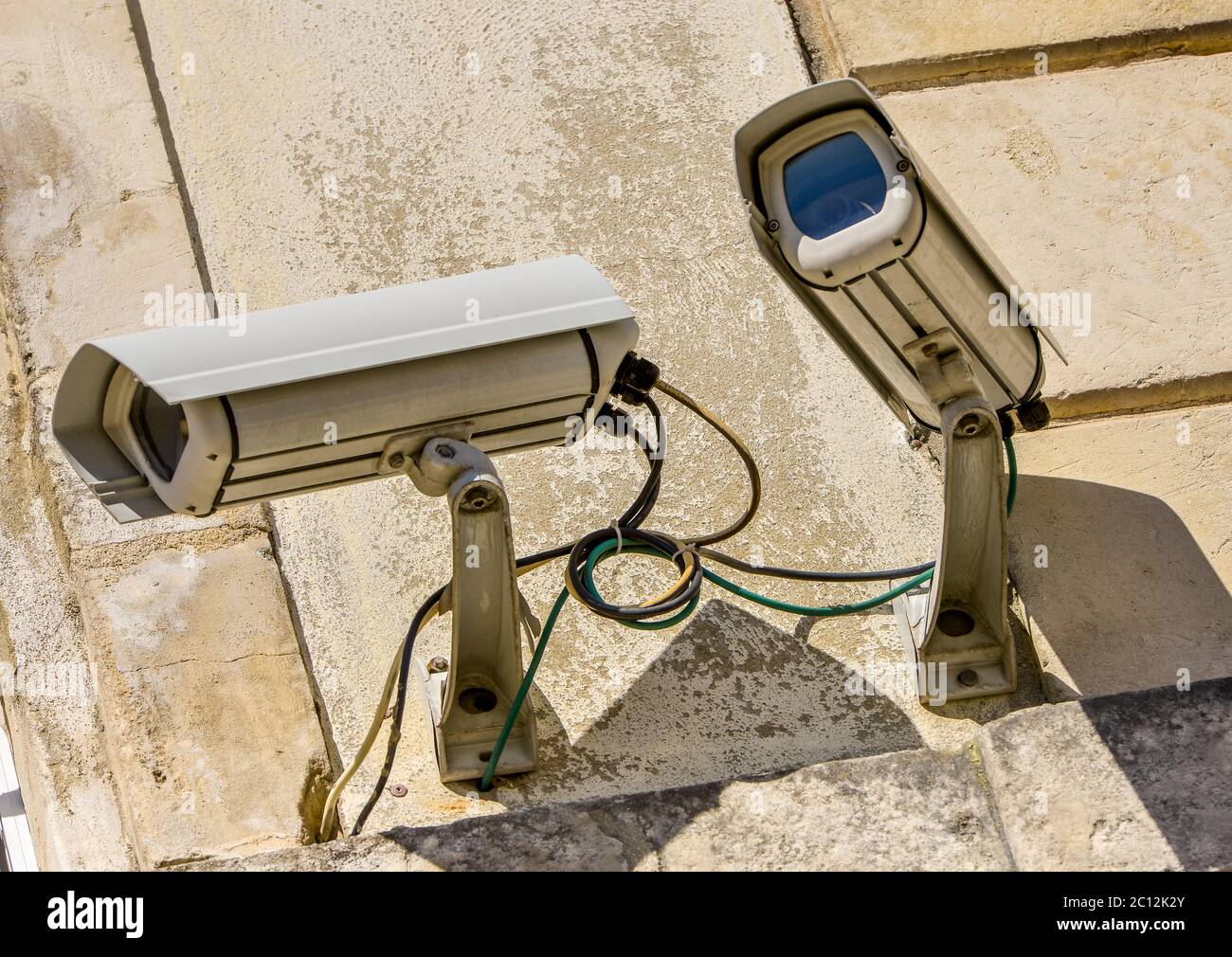 two security CCTV cameras or surveillance system in office building ...