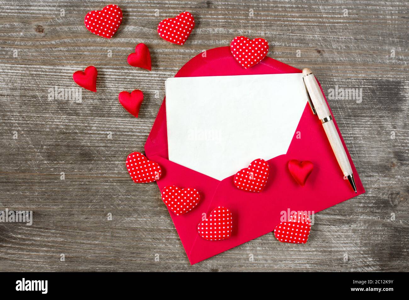 Love letter with red hearts Stock Photo - Alamy