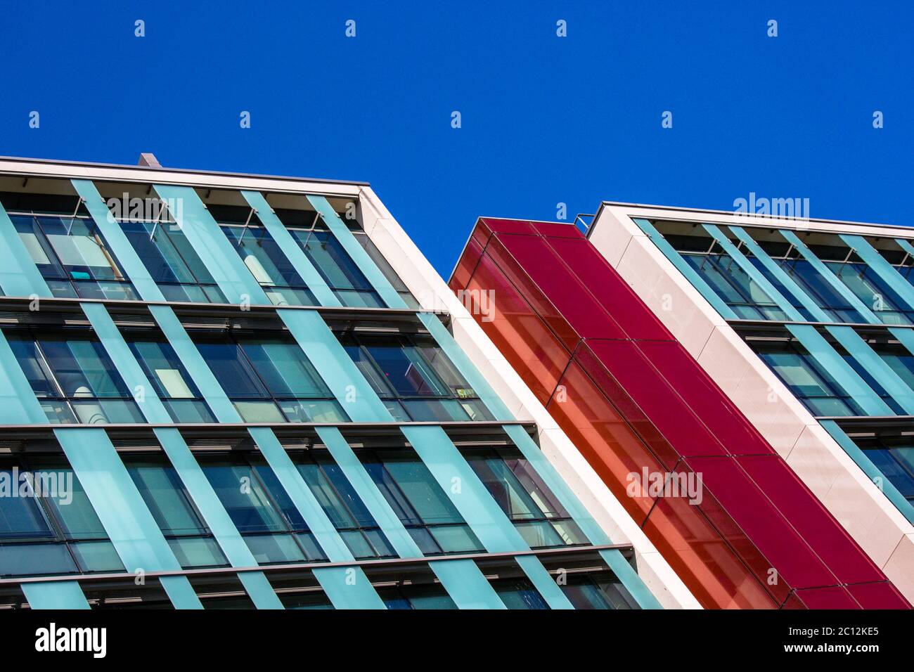 Two gigantic glass buildings adjoined together Stock Photo - Alamy