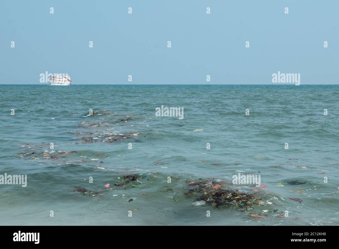 A boat on a polluted sea full of trash in Cambodia Asia Stock Photo - Alamy