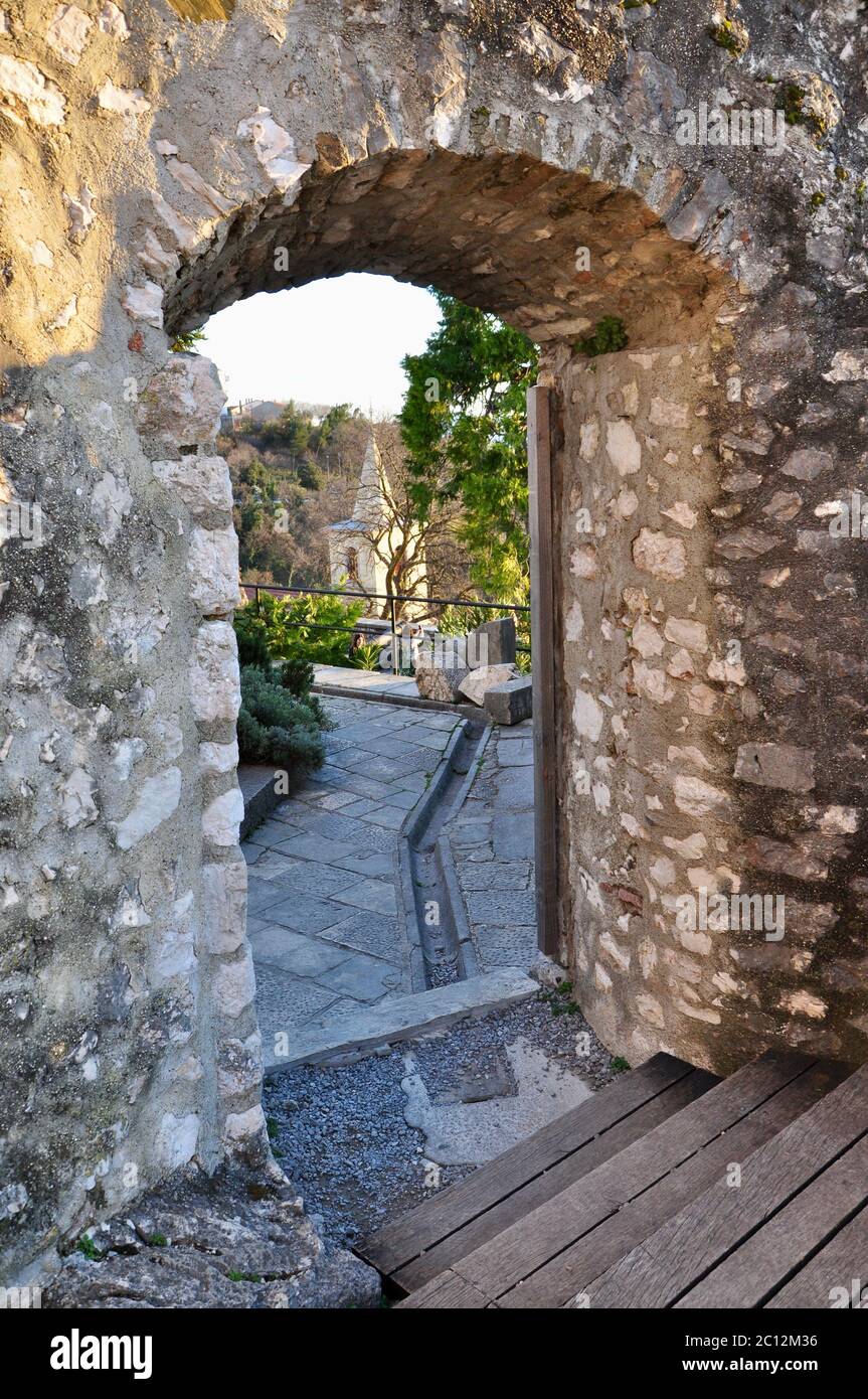 Medieval stone arch entrance in the history public castle Gradina in ...