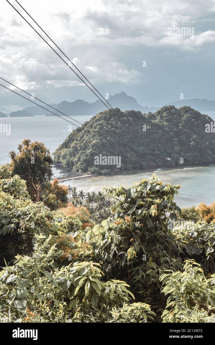 Cable line over green tropical jungle in El Nido Palawan Island the ...