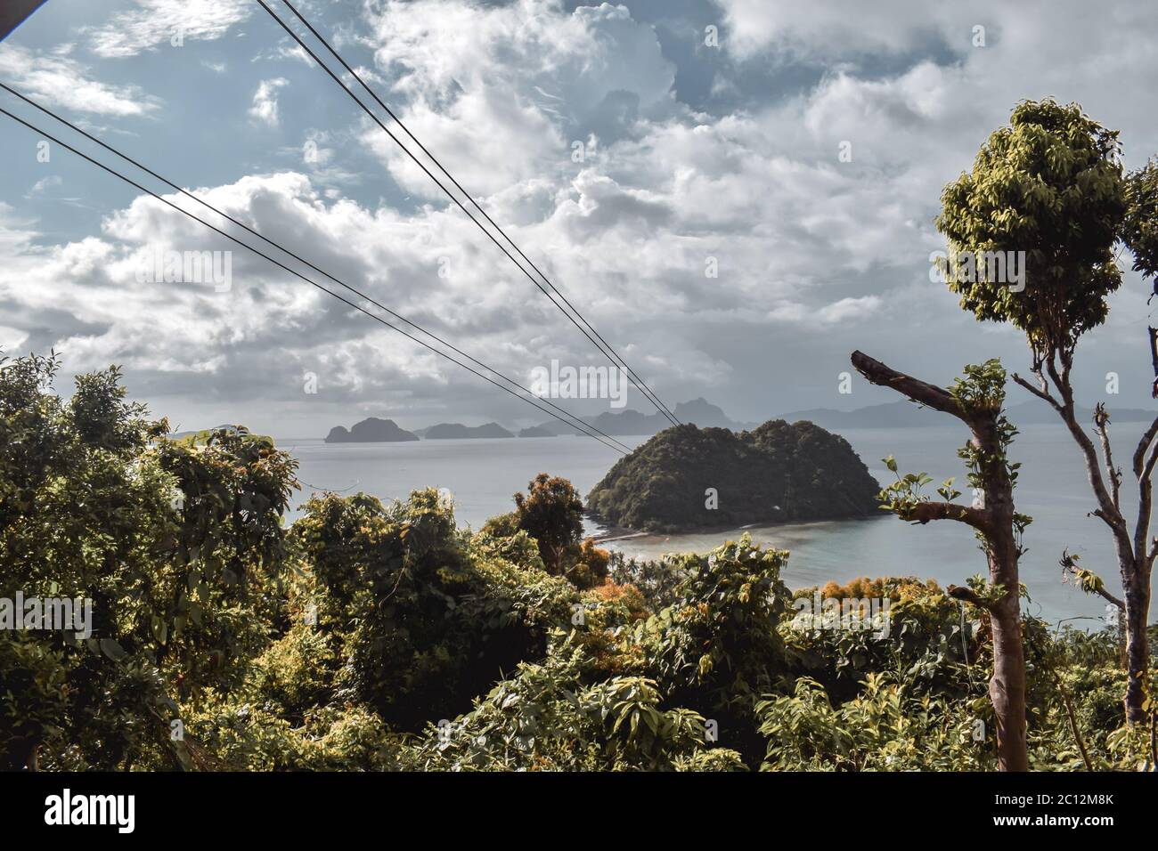 Cable line over tropical jungle and sea shore in El Nido Palawan Island ...