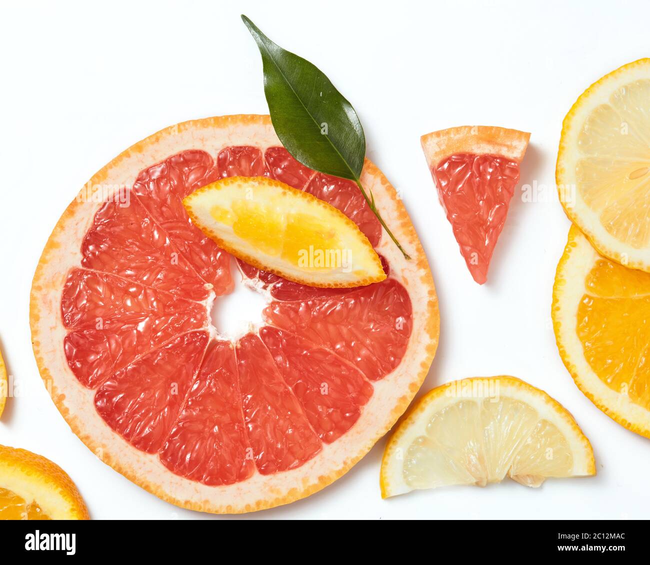 citrus slices on white background Stock Photo - Alamy