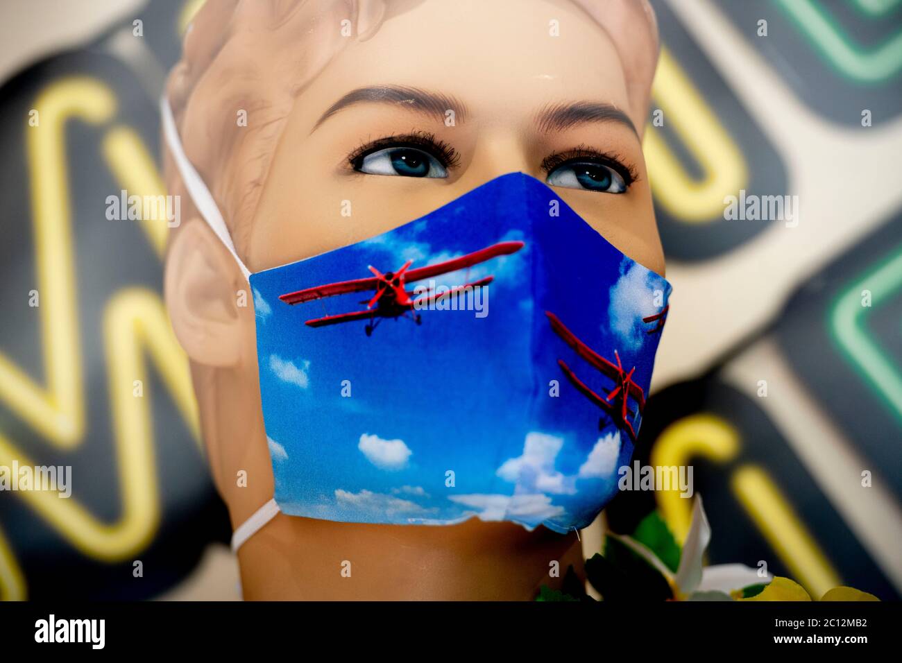 A dummy wearing a face mask at a store.Wearing face masks has become ...