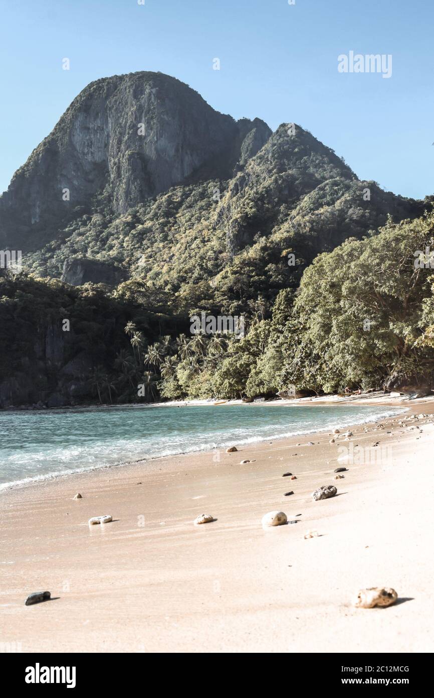 Limestone rock on a beautiful tropical Paradise beach with stones and ...