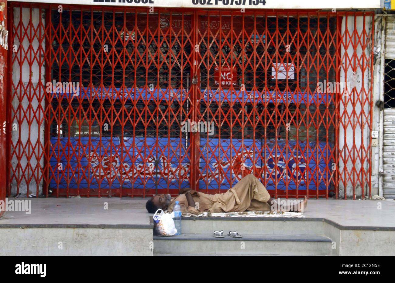 Labor is taking rest and nap under the shade as he is exhausting by the ...