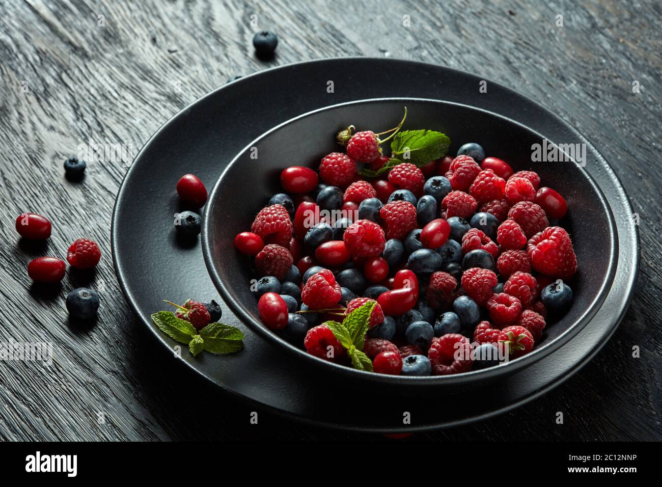 fresh berries on black background Stock Photo - Alamy
