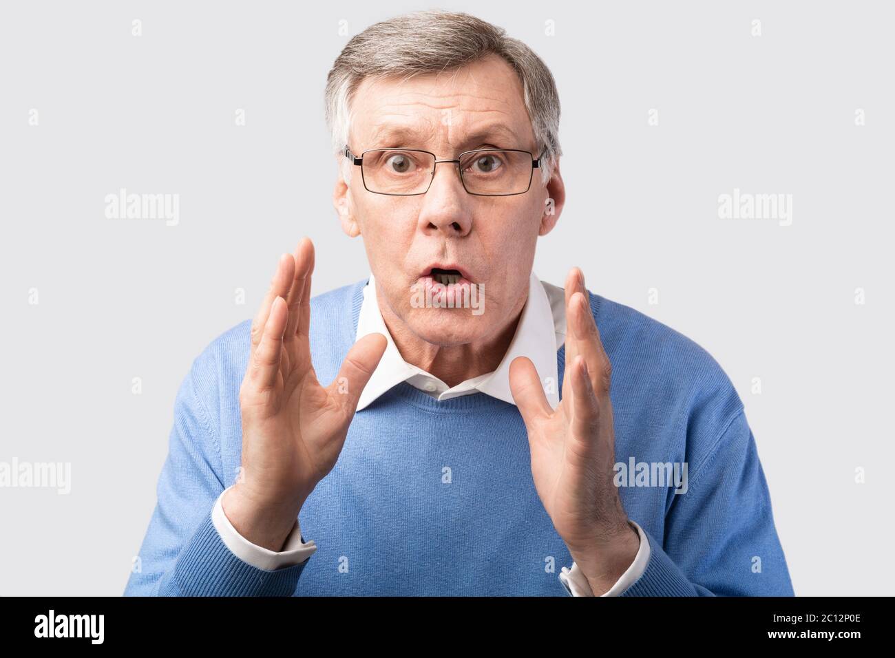 Shocked Elderly Man Looking At Camera Posing Over Gray Background Stock ...